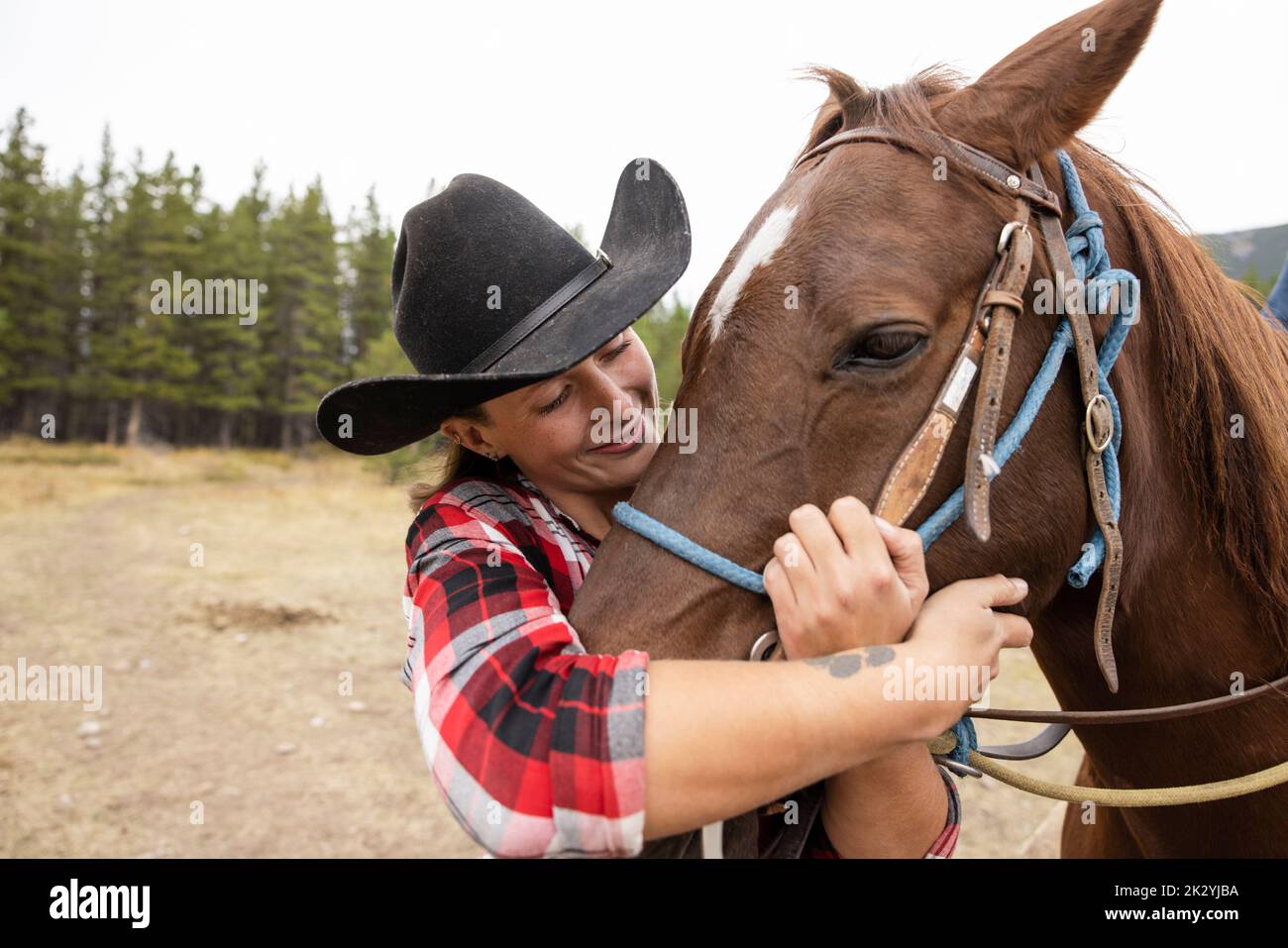 A cowgirl hugging her horse hi-res stock photography and images - Alamy