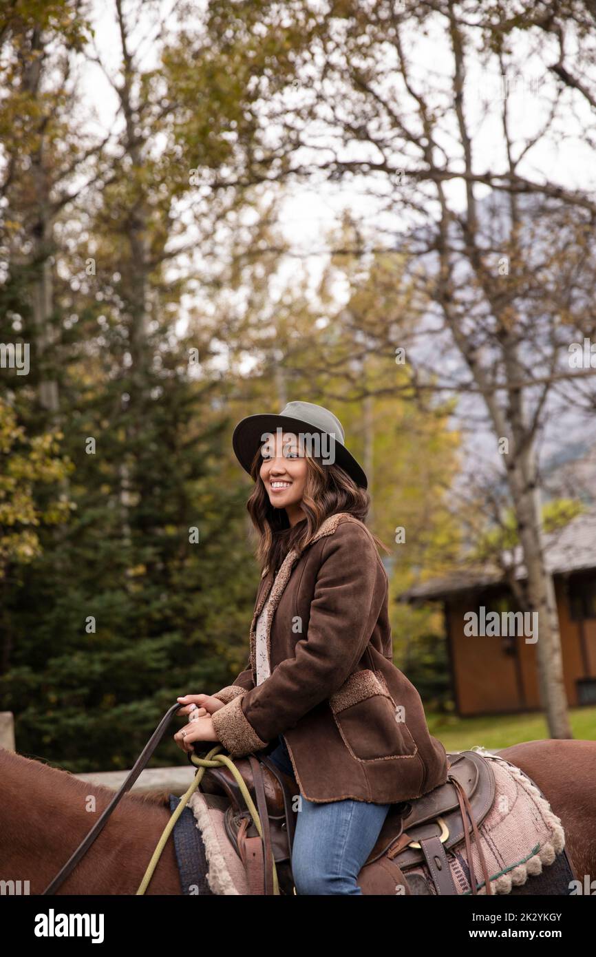 Person riding on horseback away hi-res stock photography and images - Alamy