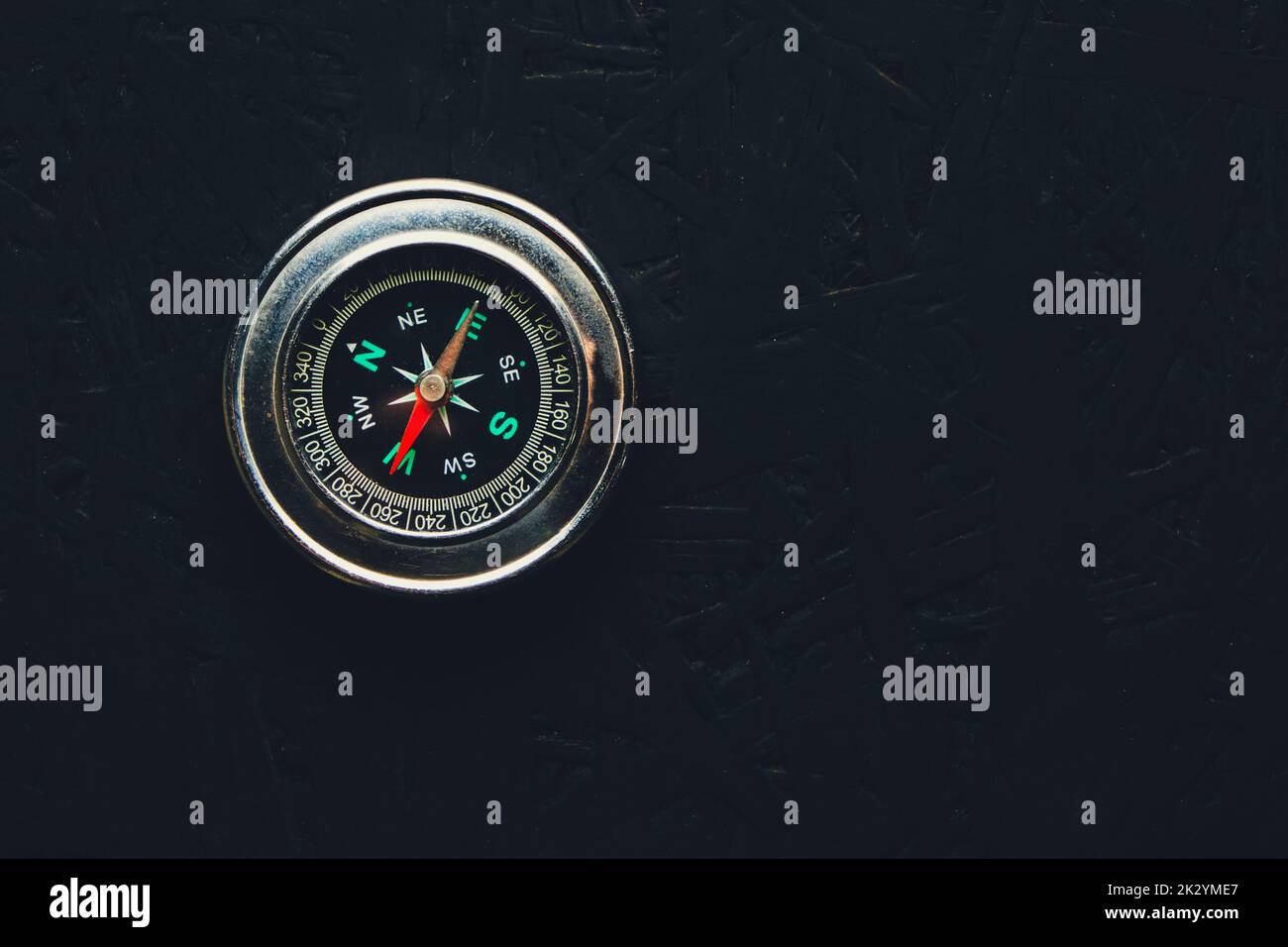 Compass pointing west lies table with an empty space for inscription ...