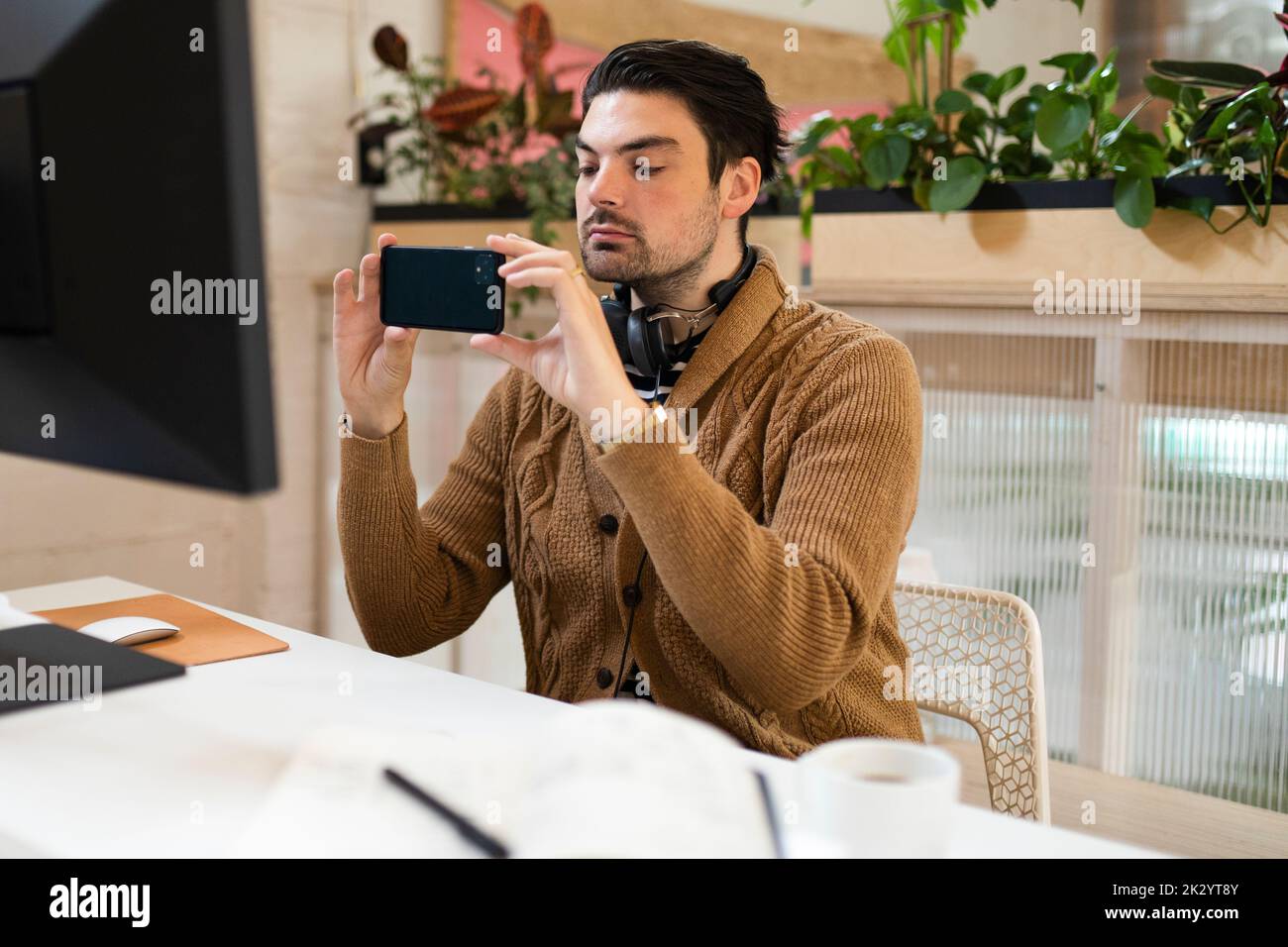 Startup business owner taking photo of work on computer Stock Photo - Alamy
