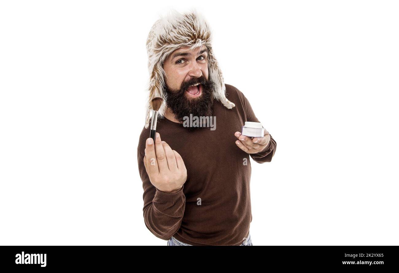 Applying makeup face tone. Powder cosmetics. Man bearded stylist wear ...