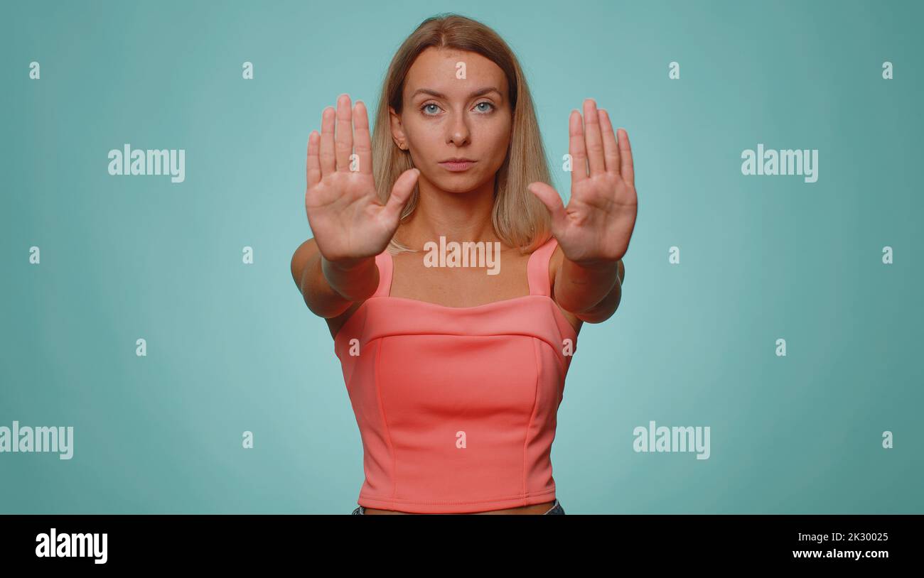 No stop. Serious adult woman say No, hold palm folded crossed hands in ...
