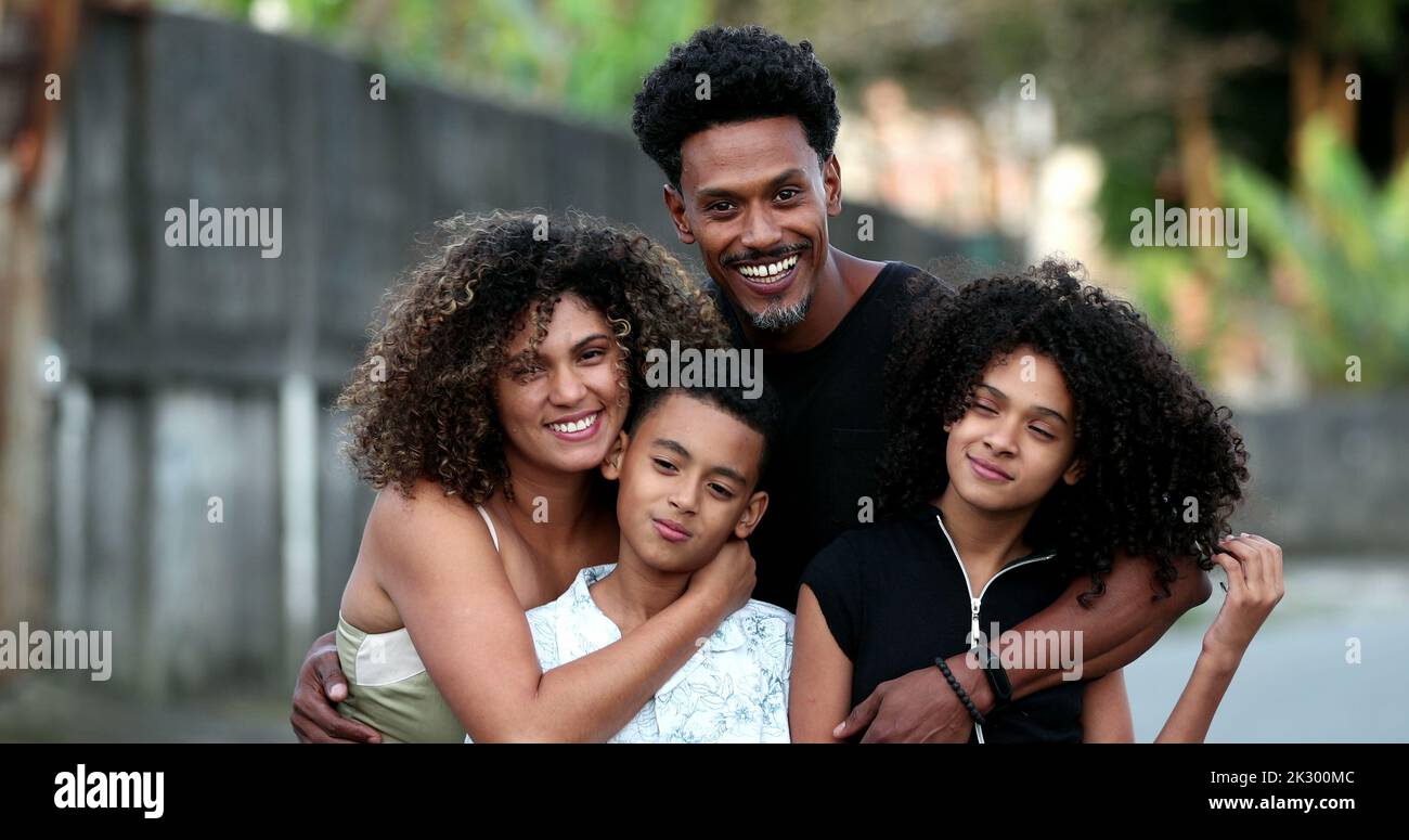 African family portrait standing for photo outside. Smiling black ...
