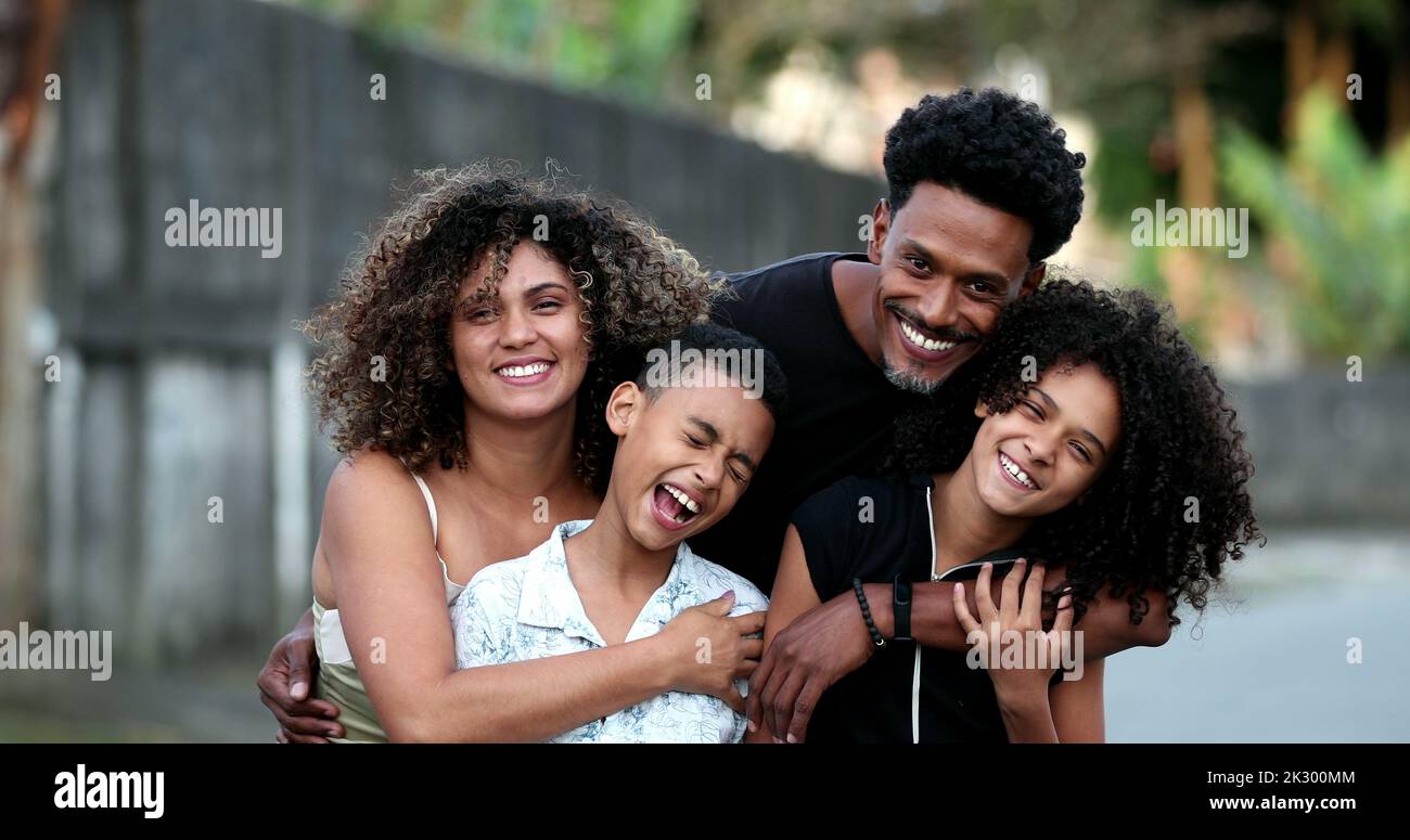 African family portrait standing for photo outside. Smiling black ...