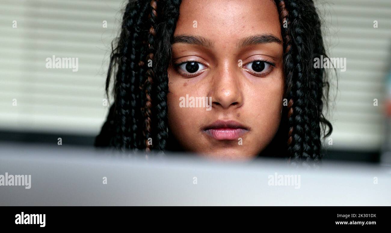 Black girl child face looking at computer screen monitor Stock Photo ...