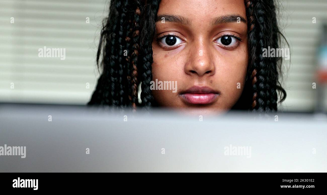 Black girl child face looking at computer screen monitor Stock Photo ...