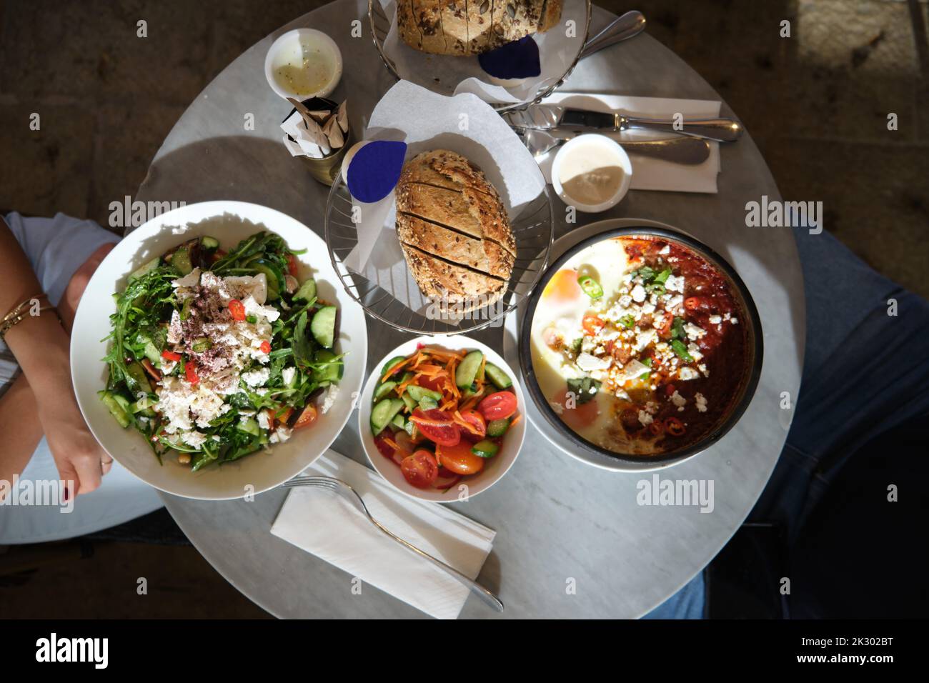 a couple at a restaurant having breakfast together on on their free ...