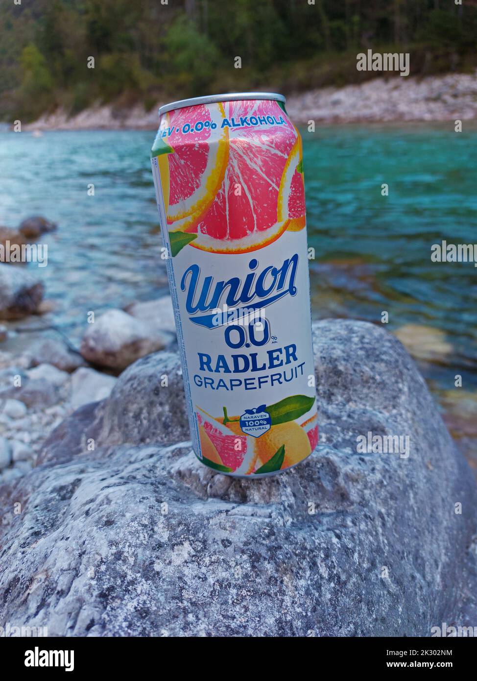 Union non alcoholic Radler can at the river banks of the river Soca in ...