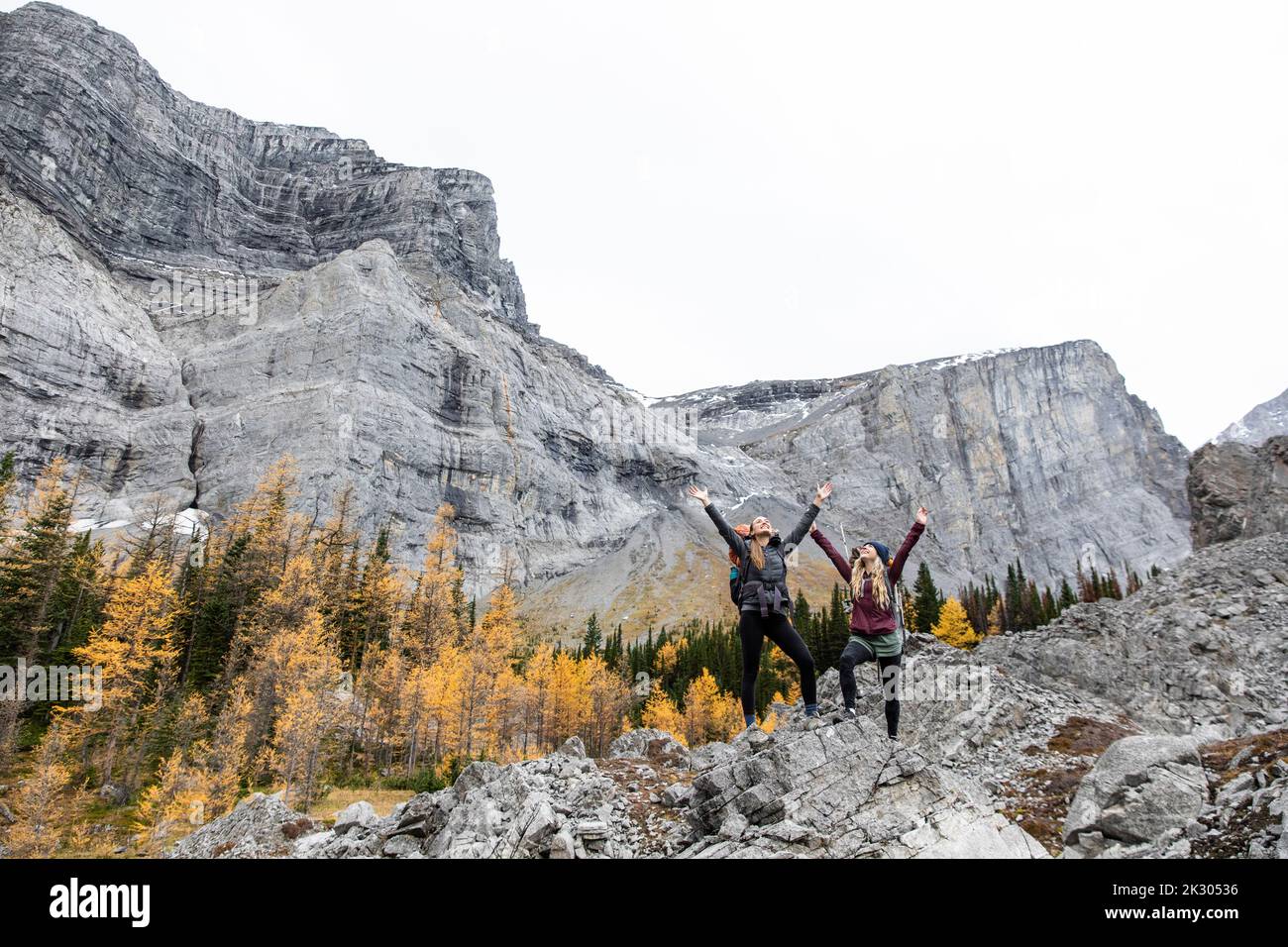 Carefree young female hikers on rugged autumn mountain slope Stock ...