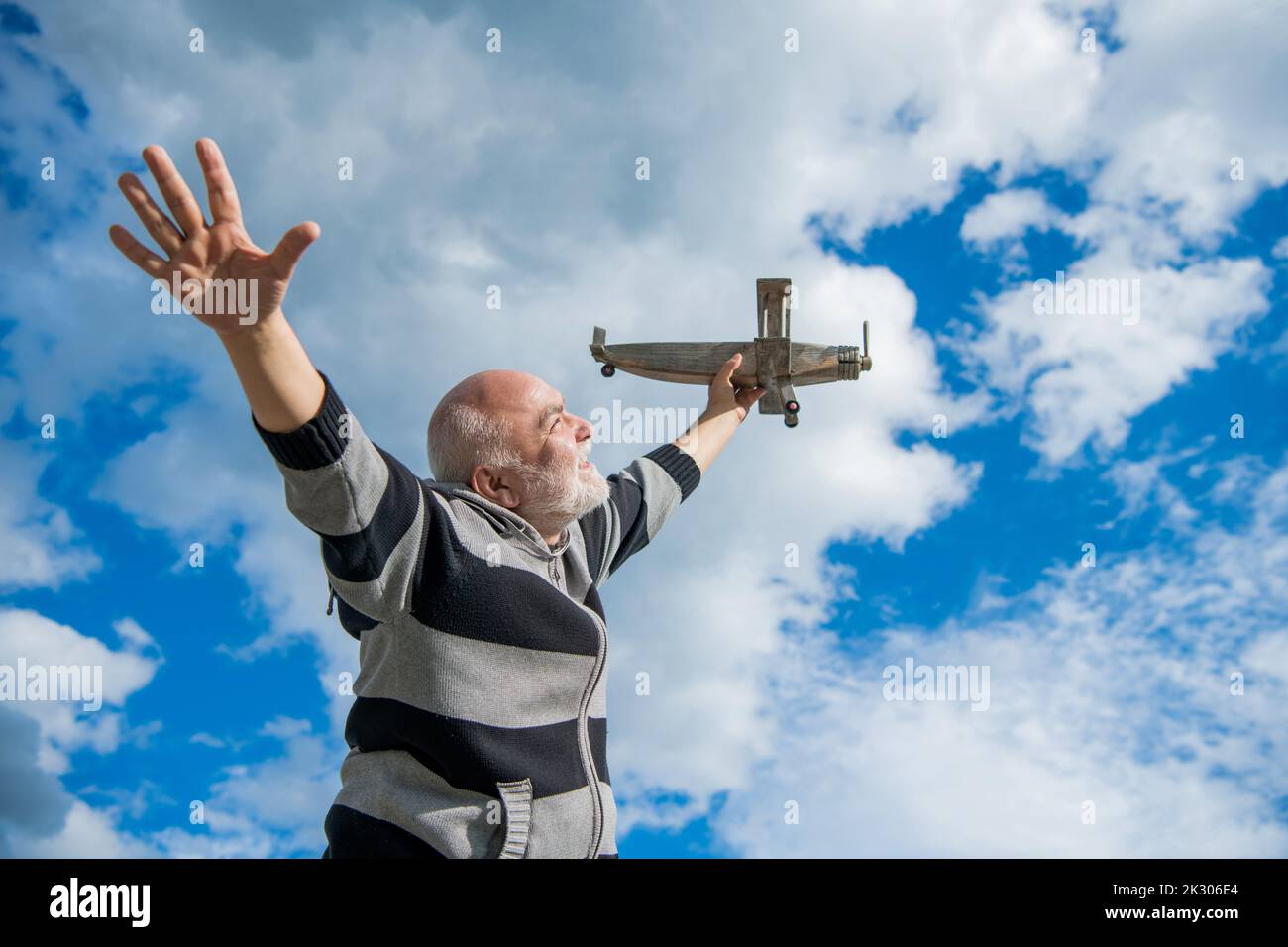 happy retirement. elderly granddad with toy. retired old man outdoor ...