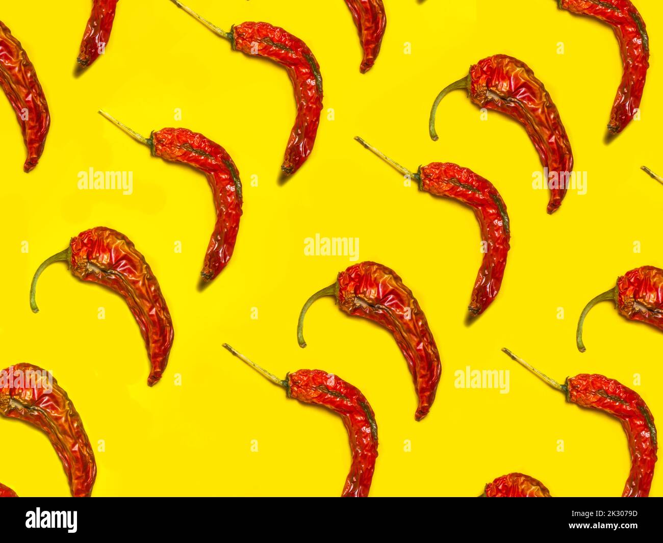 Pattern of dried red chili peppers. Chili pepper on a yellow background ...