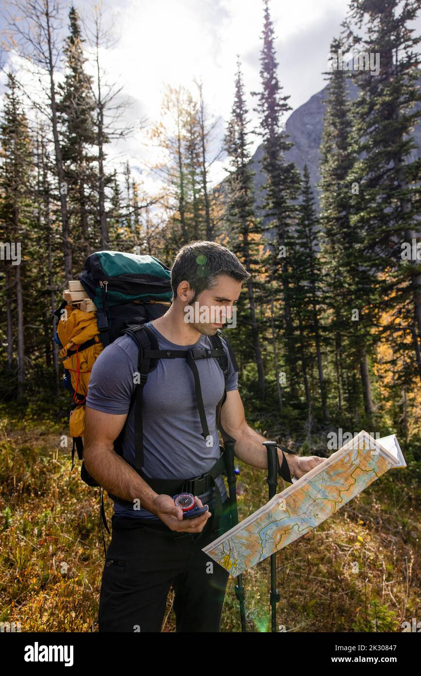 Man using compass outdoors hi-res stock photography and images - Alamy