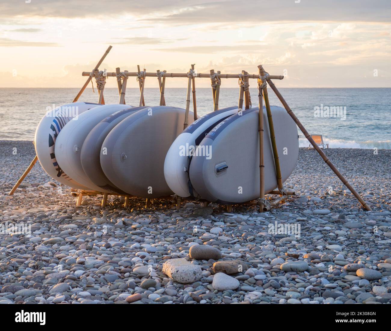 Folded windsurf boards. At sunset. Sports equipment at sea. Boards for ...