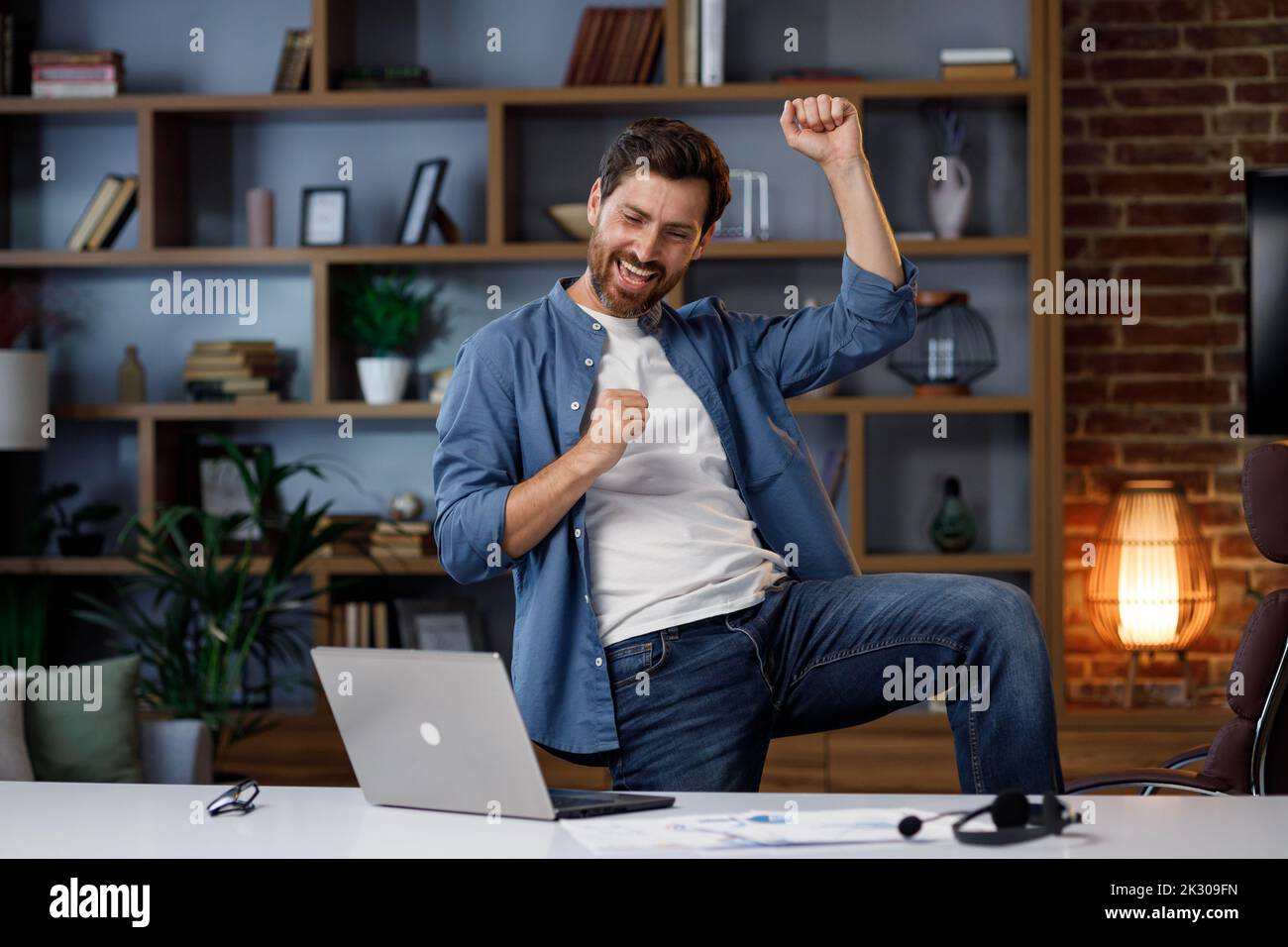 A handsome male businessman successfully completed his job and began to ...