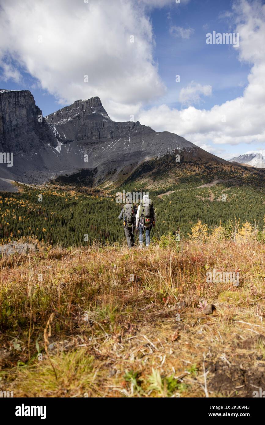 Couple backpacking in majestic sunny scenic mountains hi-res stock ...
