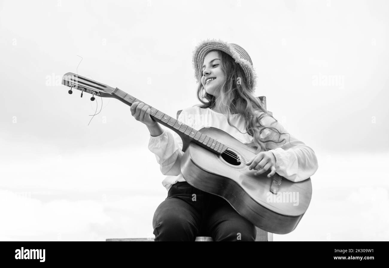 my new song. singer. happy teen girl playing guitar outdoor. happy ...