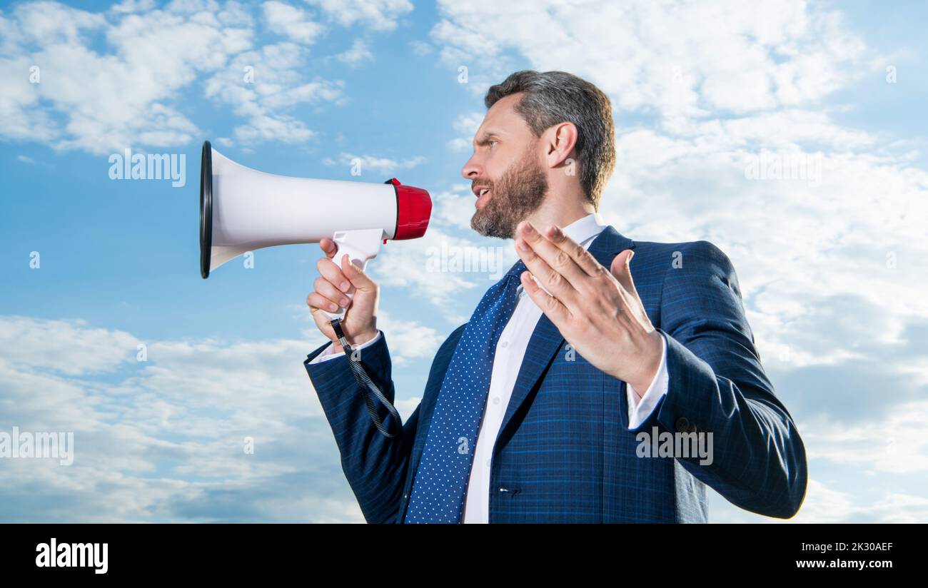 businessman gesturing and shout in loudspeaker on sky background Stock ...