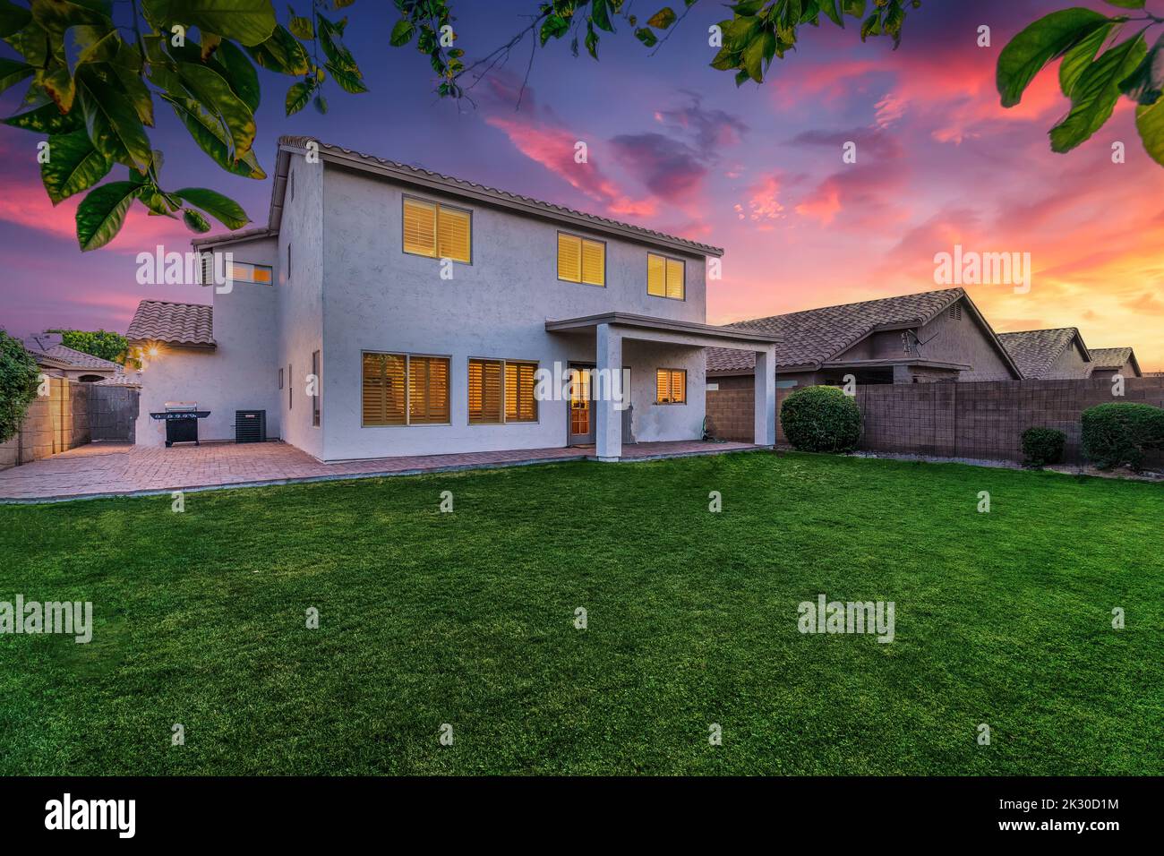 sunset back yard and patio Stock Photo - Alamy