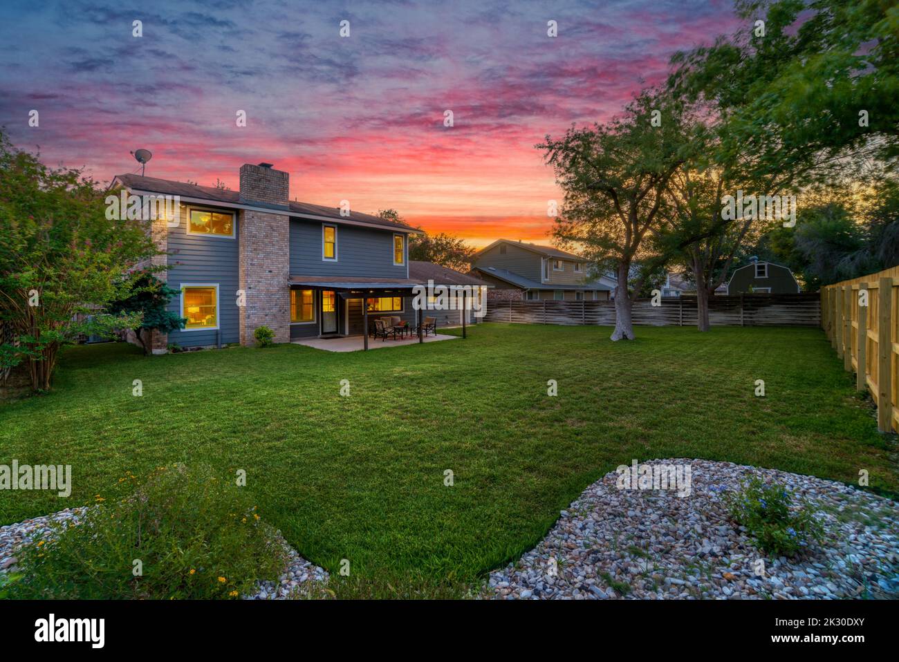sunset back yard and patio Stock Photo - Alamy