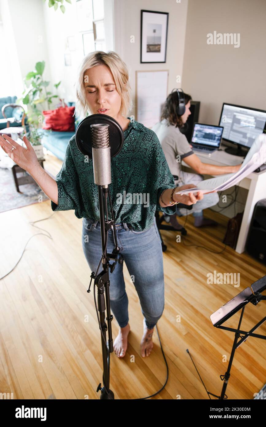 Singing into microphone hi-res stock photography and images - Alamy