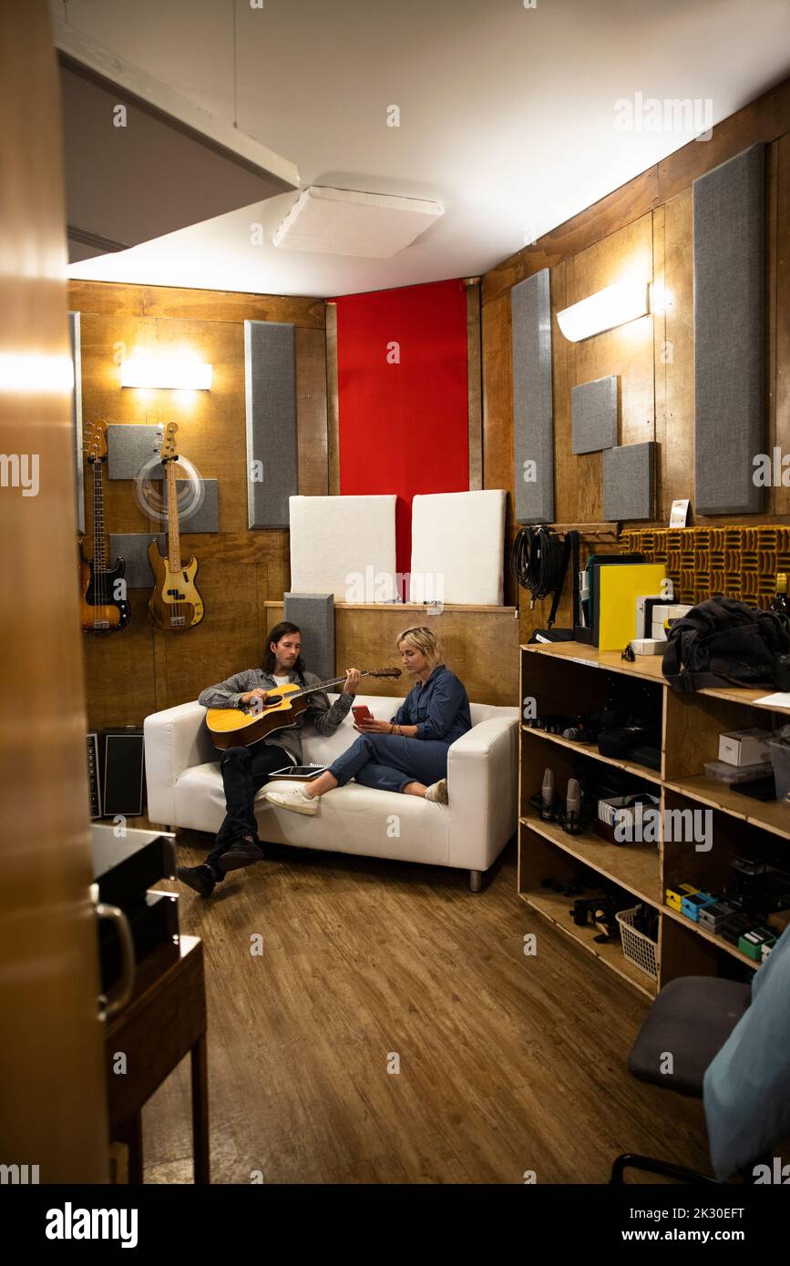 Woman sitting on couch hi-res stock photography and images - Alamy