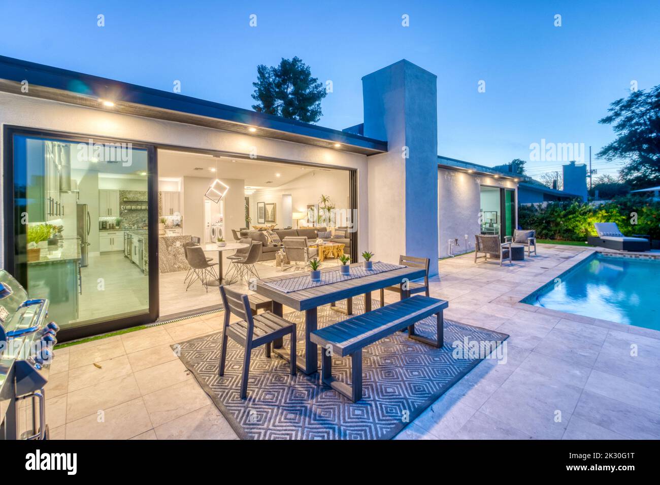 sunset back yard and patio Stock Photo - Alamy