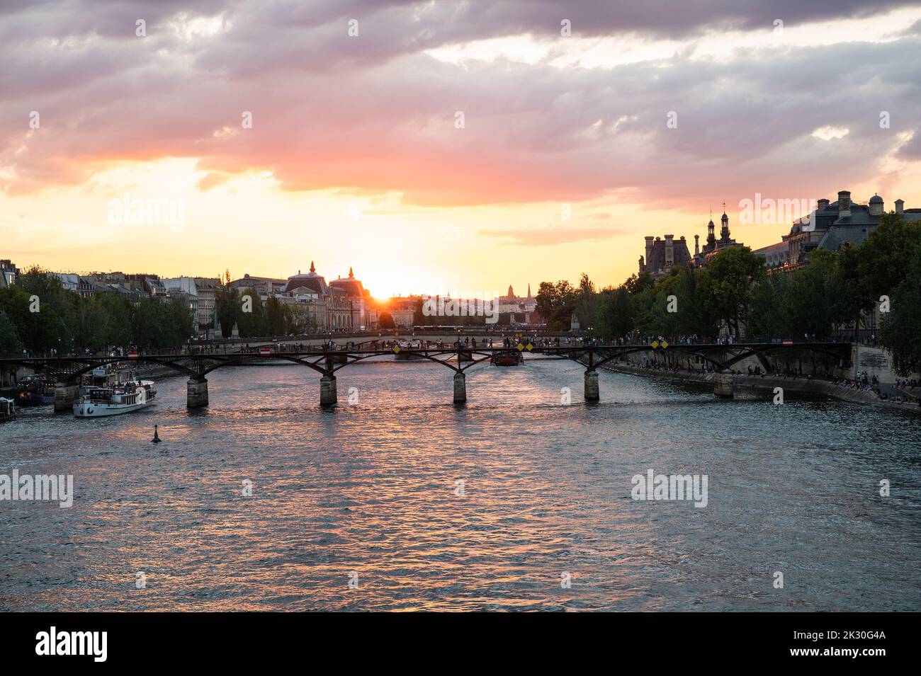 Paris, France - August 26 2022: Sunset at Bridge Pont des Arts ...