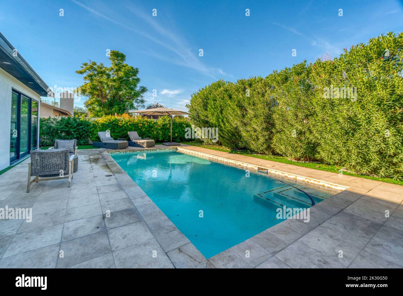 Luxury swimming pool fire pit outside hi-res stock photography and ...