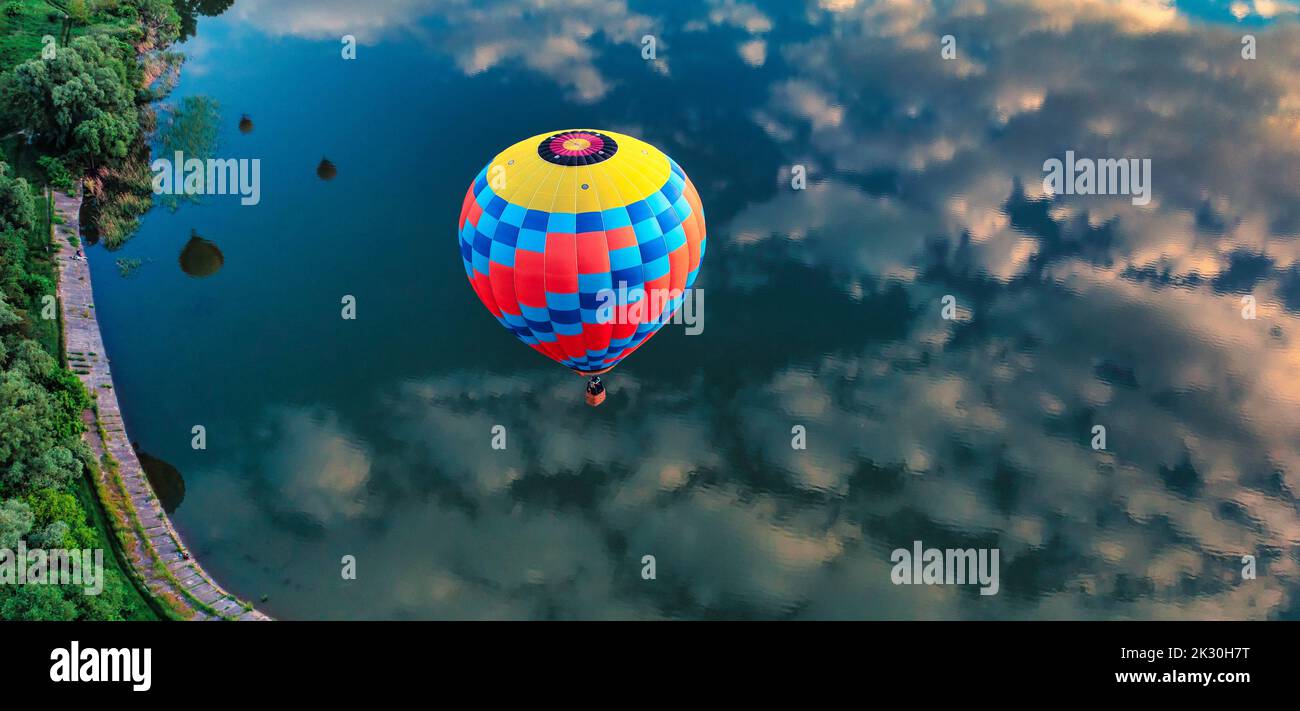 Green balloon in sky over tree hi-res stock photography and images - Alamy
