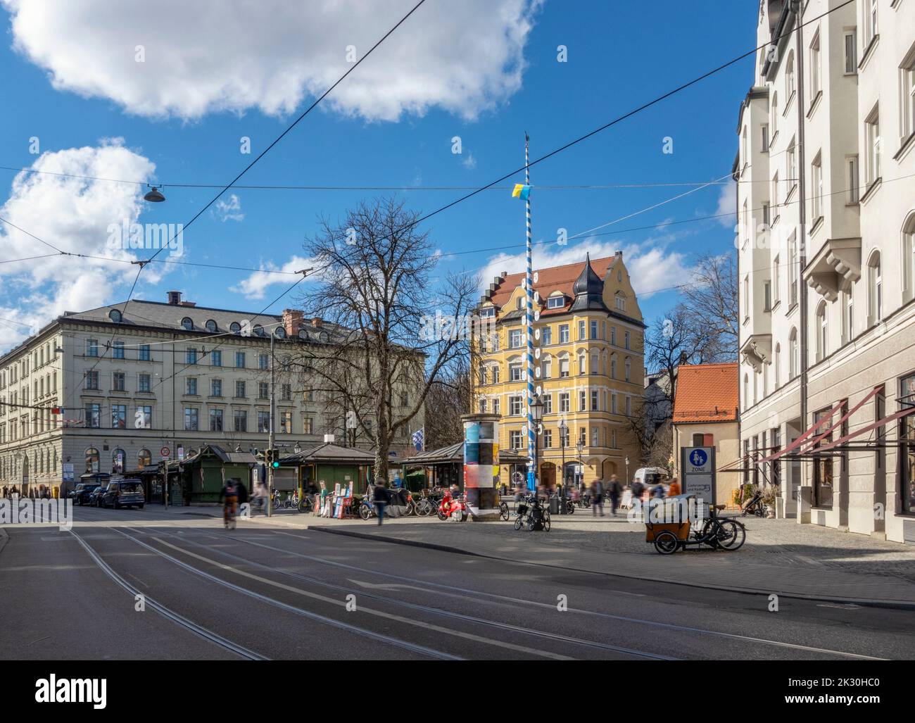Germany, Bavaria, Munich, Power lines hanging over street in front of ...