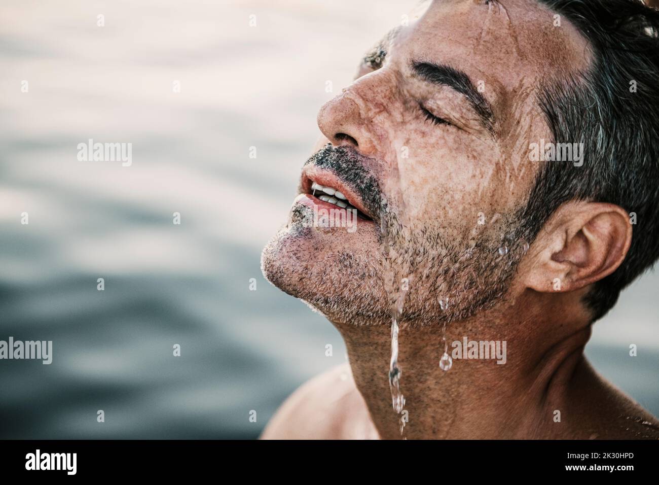 Man splashing water on his face hi-res stock photography and images - Alamy