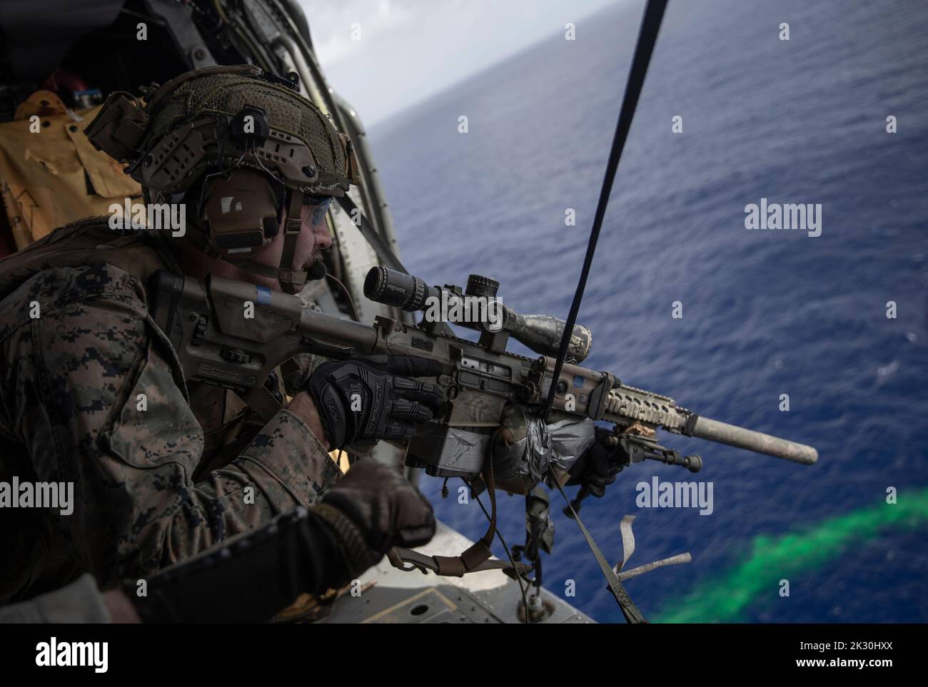 U.S. Marine Corps Cpl. Samuel Johnson, a scout sniper with Battalion Landing Team 2/5, 31 Marine ...