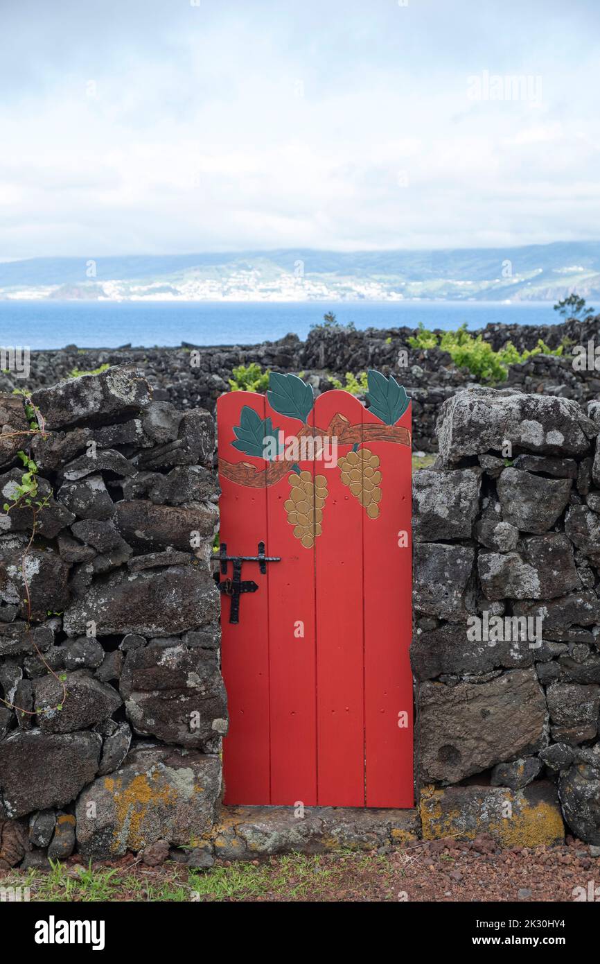 Portugal, Azores, Madalena, Wooden door in basaltic wall Stock Photo ...
