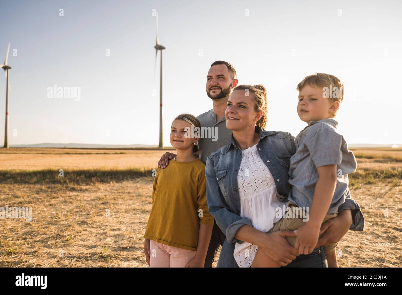 Confident family looking at distance Stock Photo - Alamy