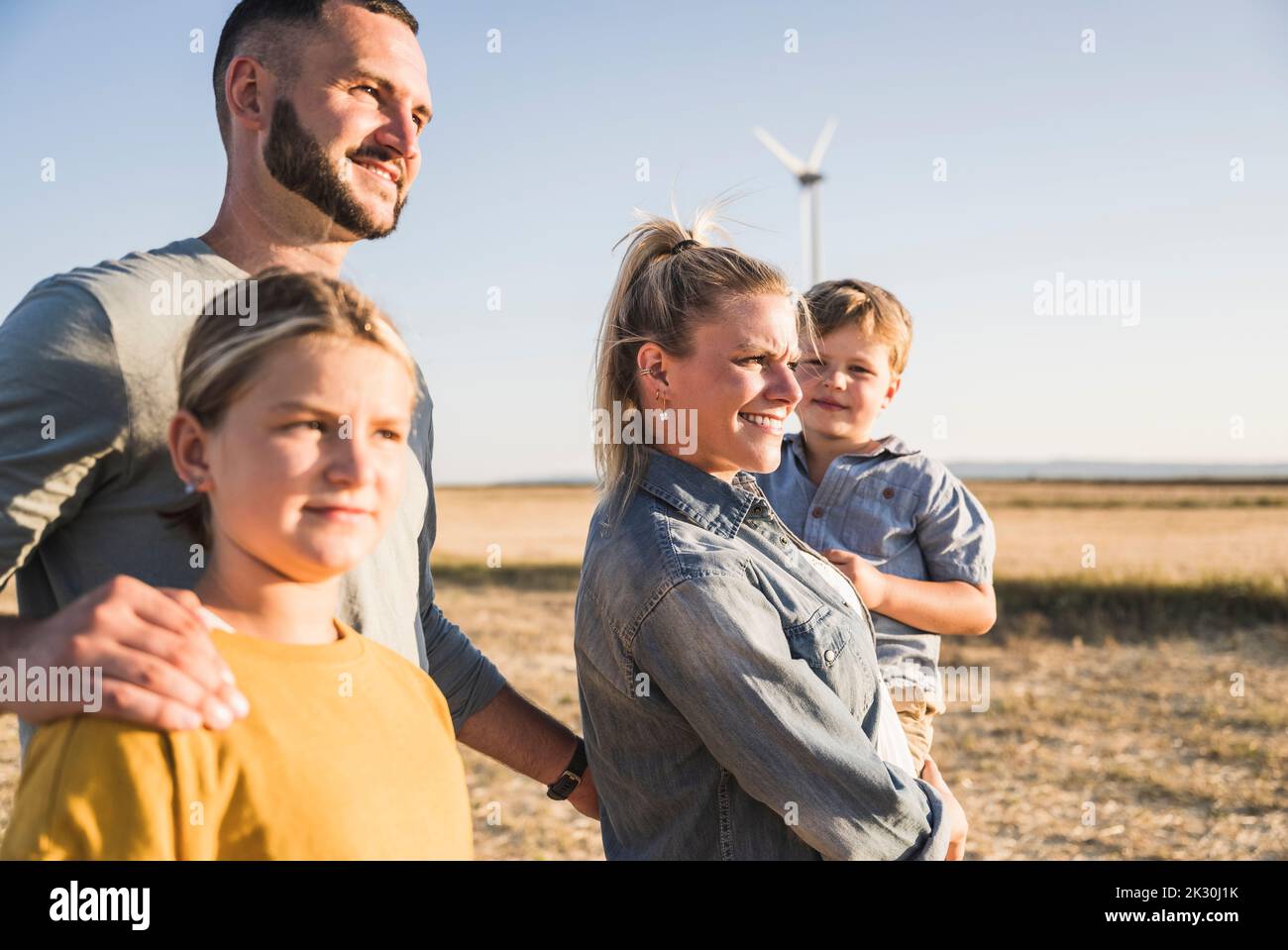 Confident family looking at distance Stock Photo - Alamy