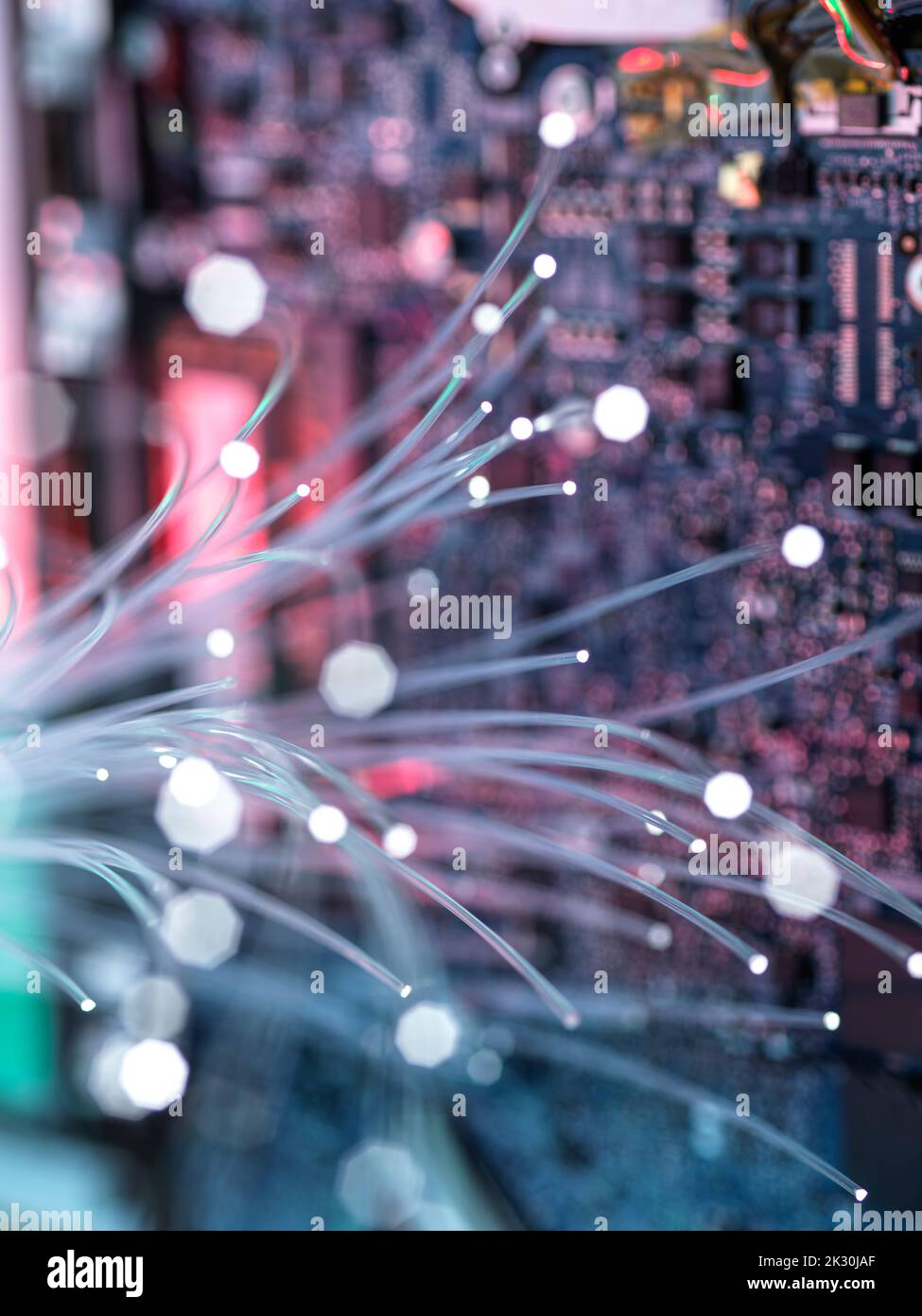 Fiber optic cables against computer mother board Stock Photo - Alamy