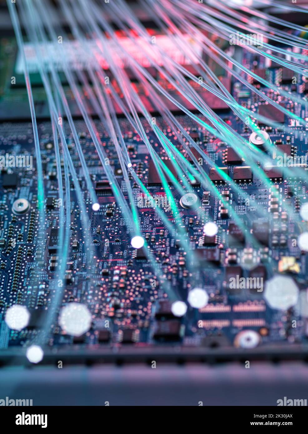 Fiber optic cables against computer mother board Stock Photo - Alamy