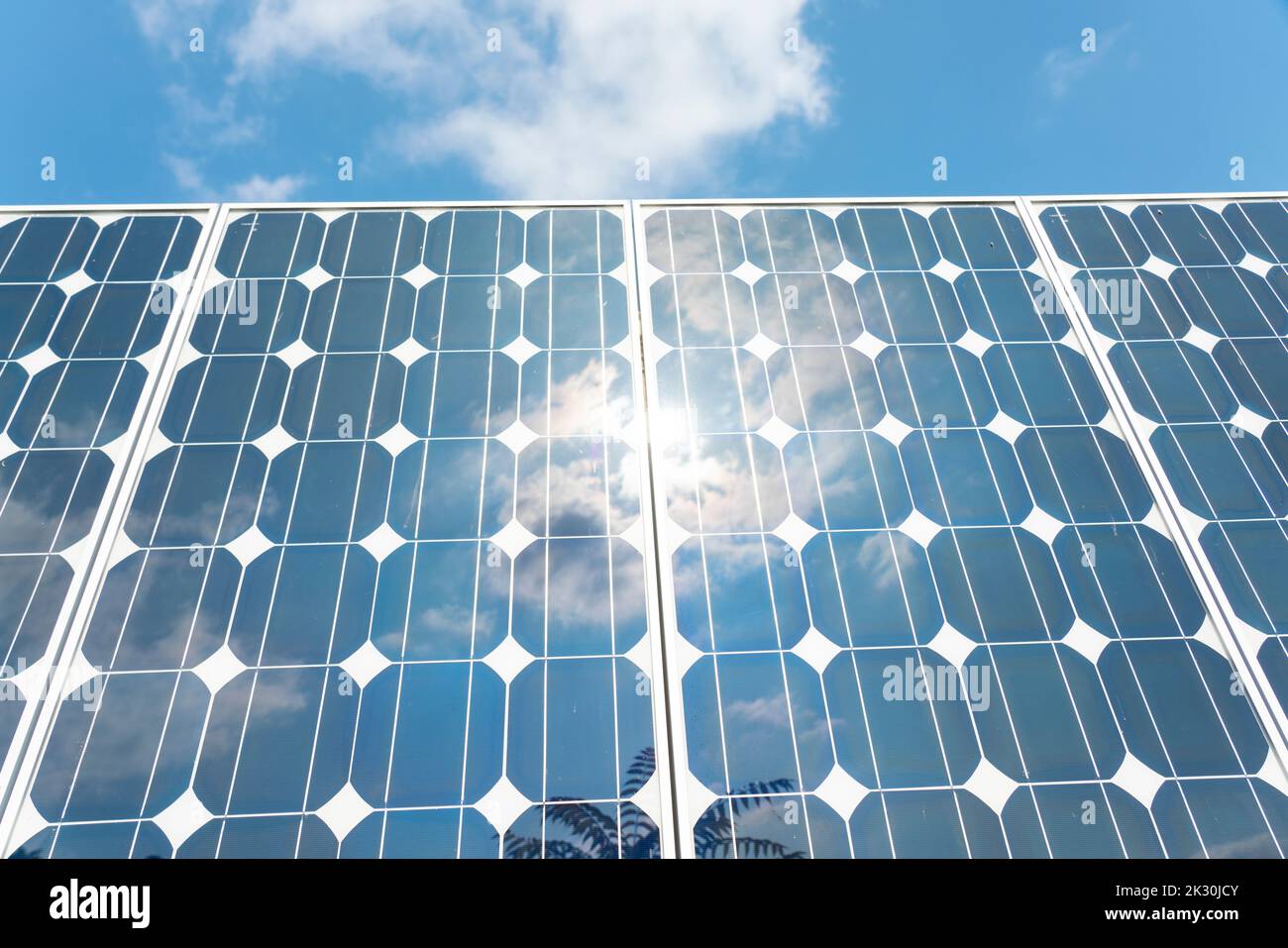Sun reflecting on shiny solar panels Stock Photo - Alamy