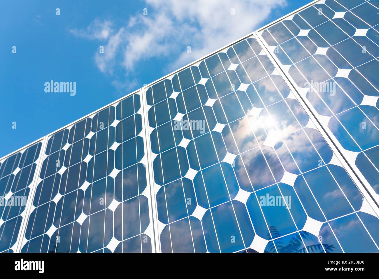 Sun reflecting on shiny solar panels Stock Photo - Alamy