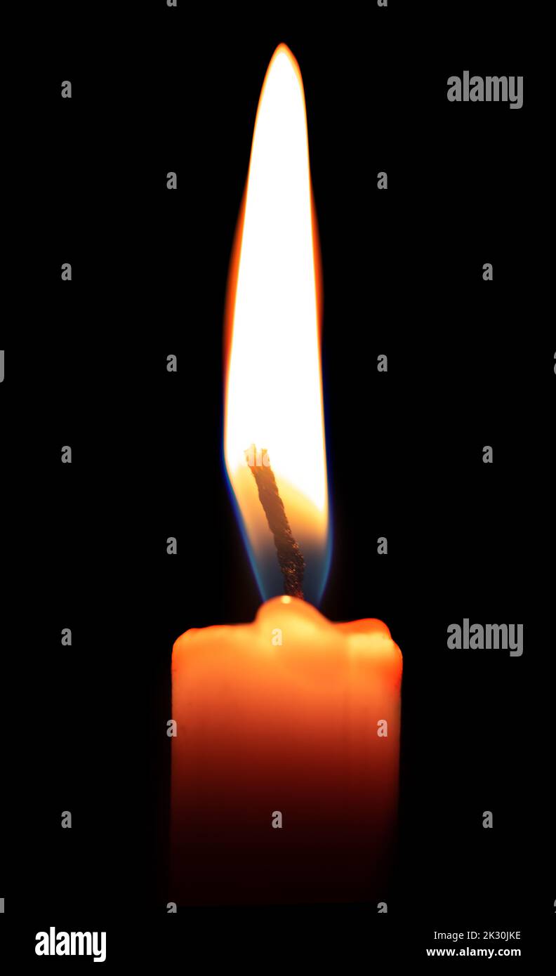 The concept of grief and loss. Candle flame on a black background ...