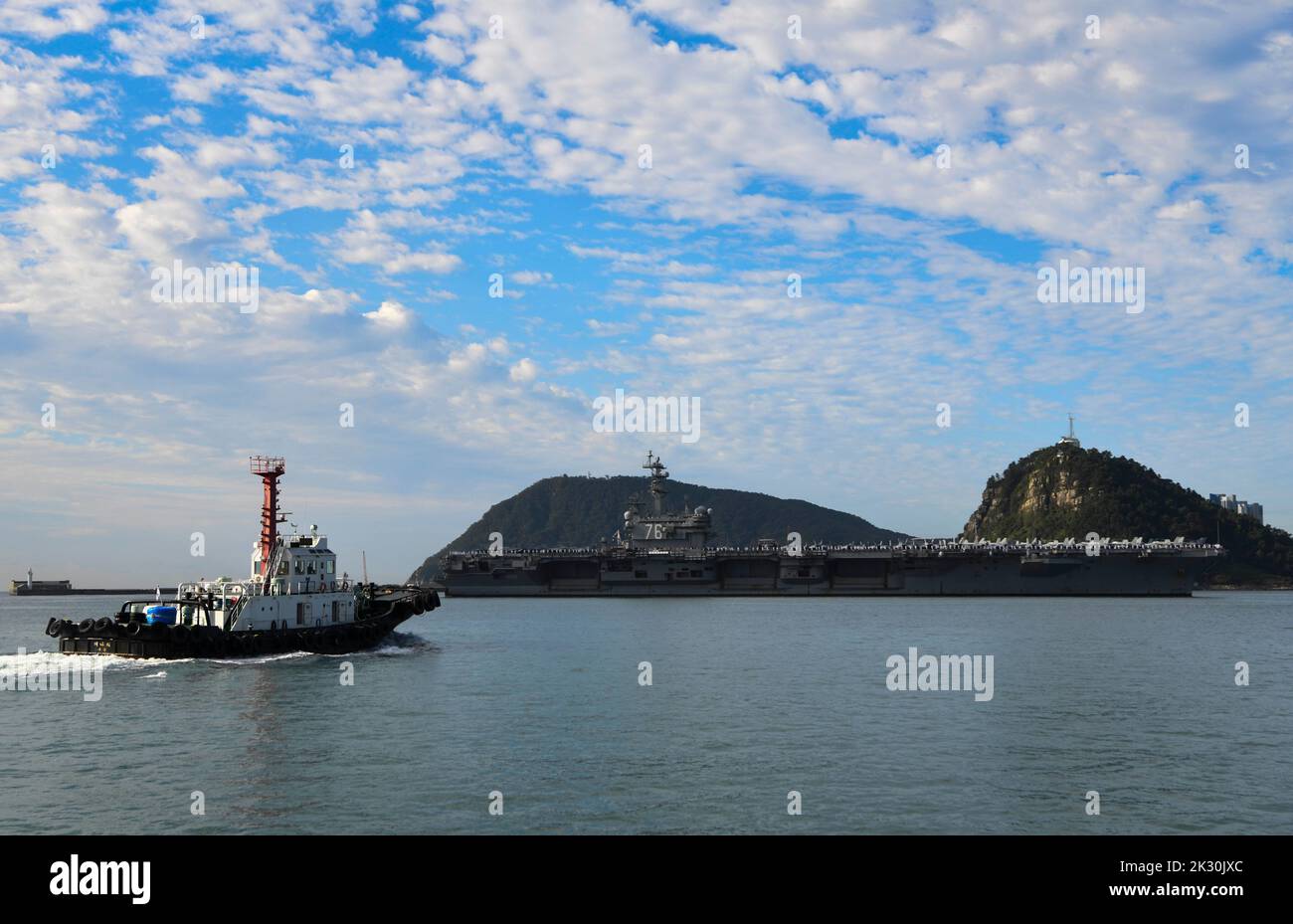 BUSAN, Republic of Korea (Sept. 23, 2022) Tugboats prepare to maneuver ...