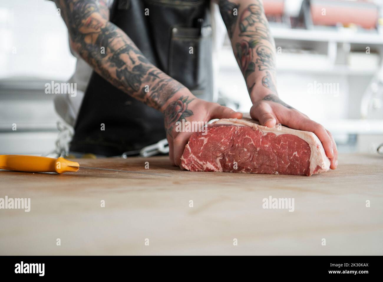Meat being prepared by butcher Stock Photo - Alamy