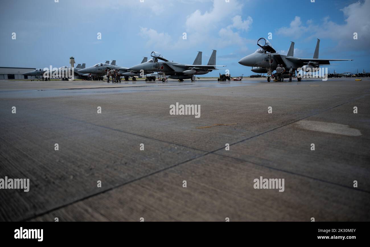 Japan Air Self-Defense Force F-15s are prepped for take-off in support ...