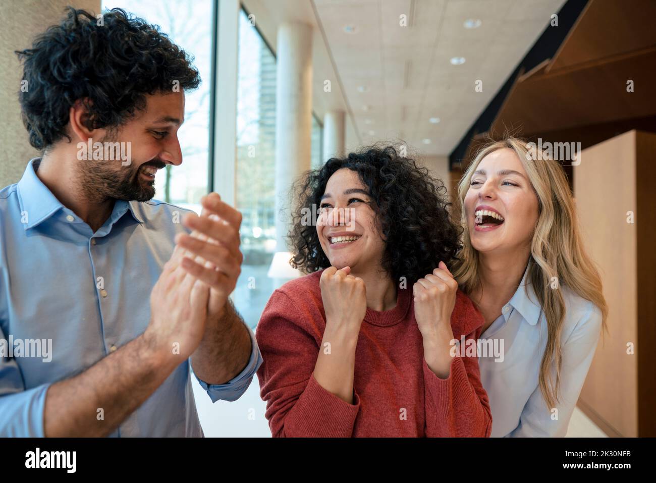 Happy multiracial colleagues enjoying in university library Stock Photo ...