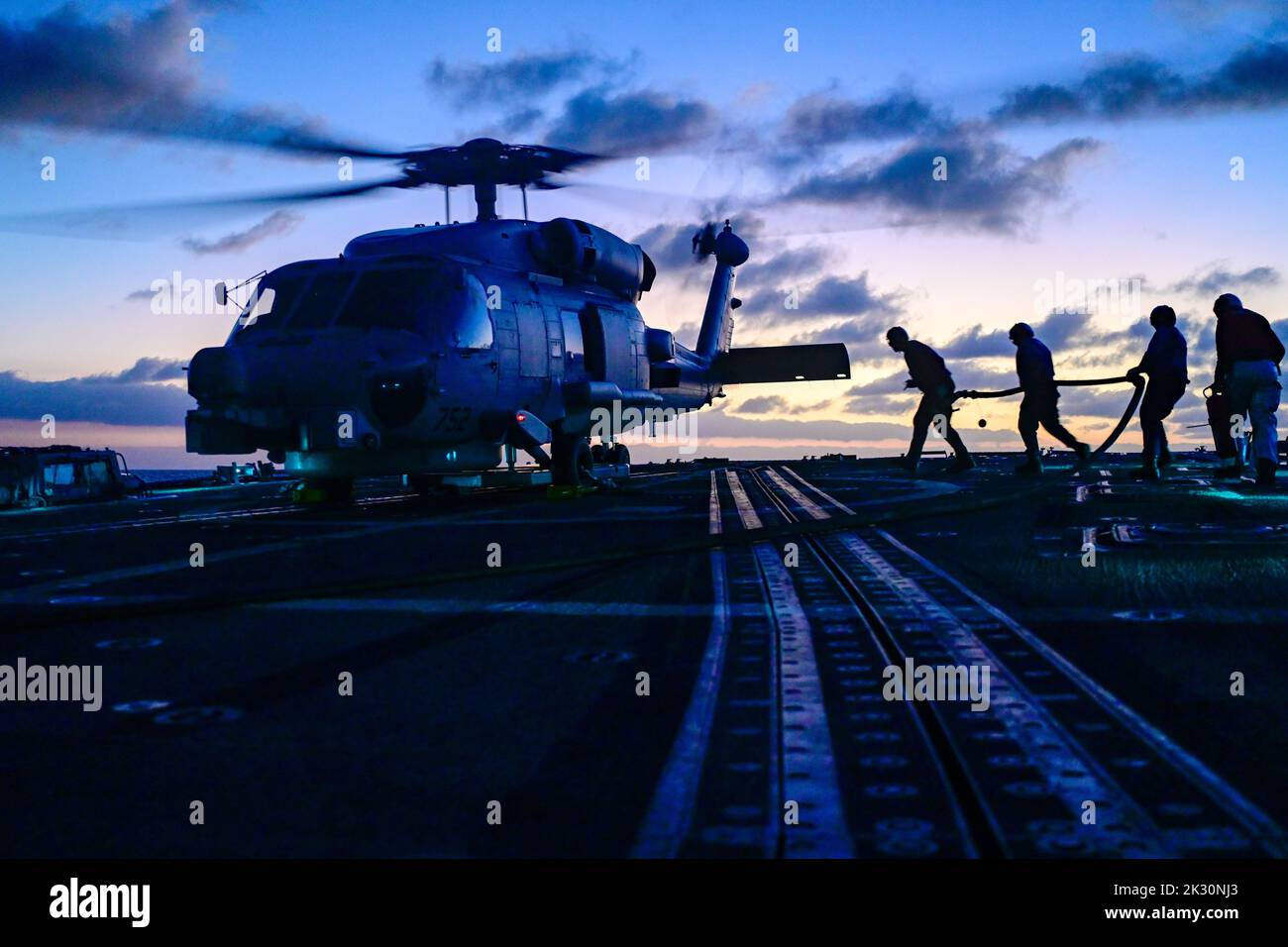 U.S. Sailors assigned to the Arleigh Burke-class guided-missile ...
