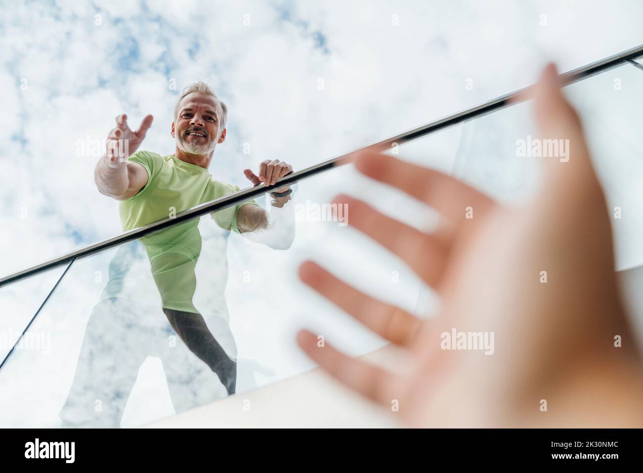 Hand reaching for railing hi-res stock photography and images - Alamy