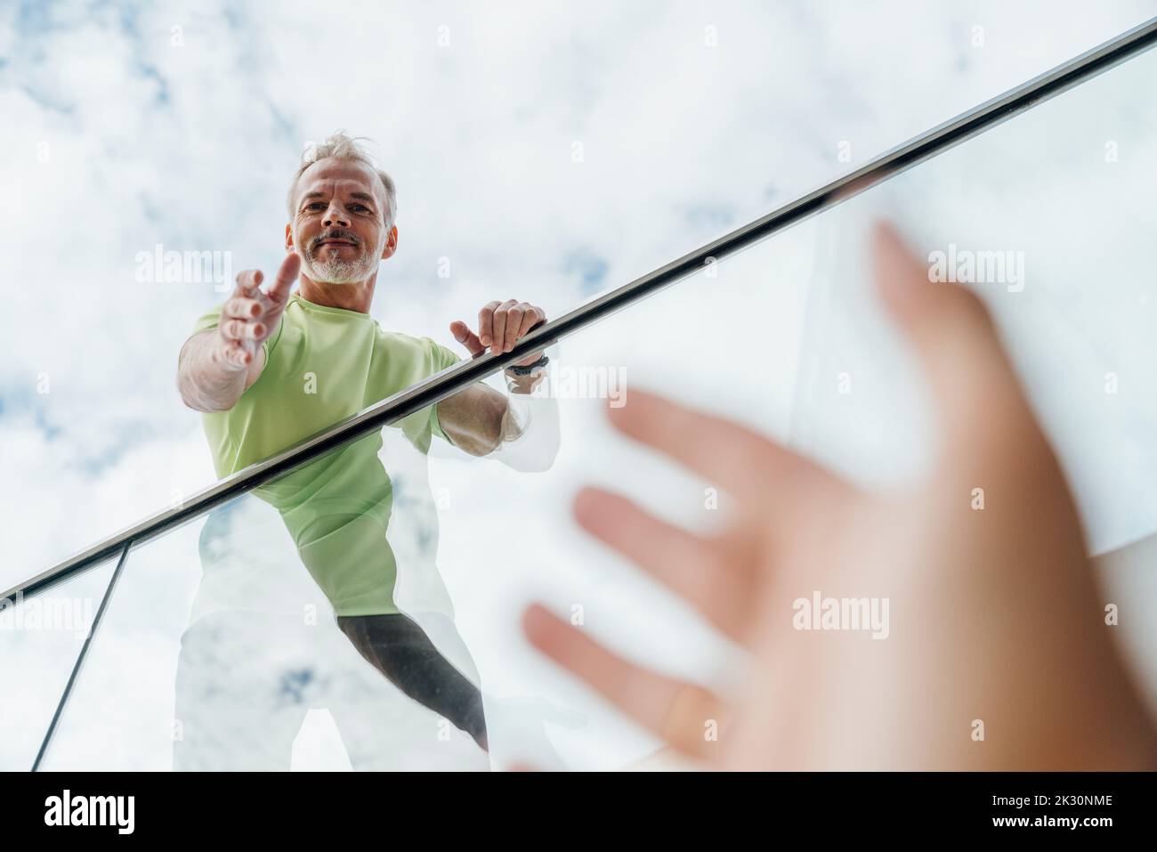 Hand reaching for railing hi-res stock photography and images - Alamy
