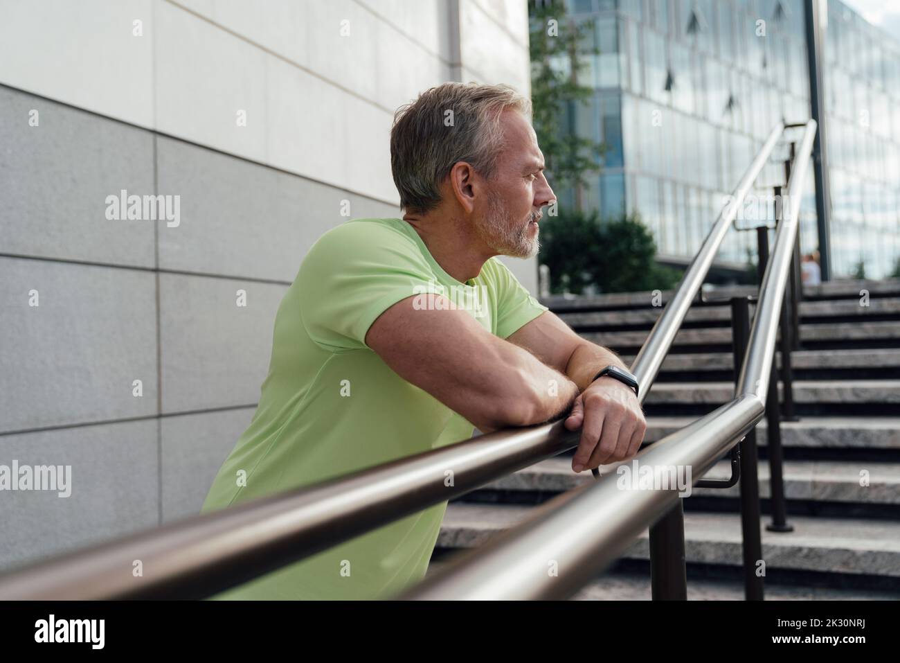Leaning on metal railing hi-res stock photography and images - Alamy