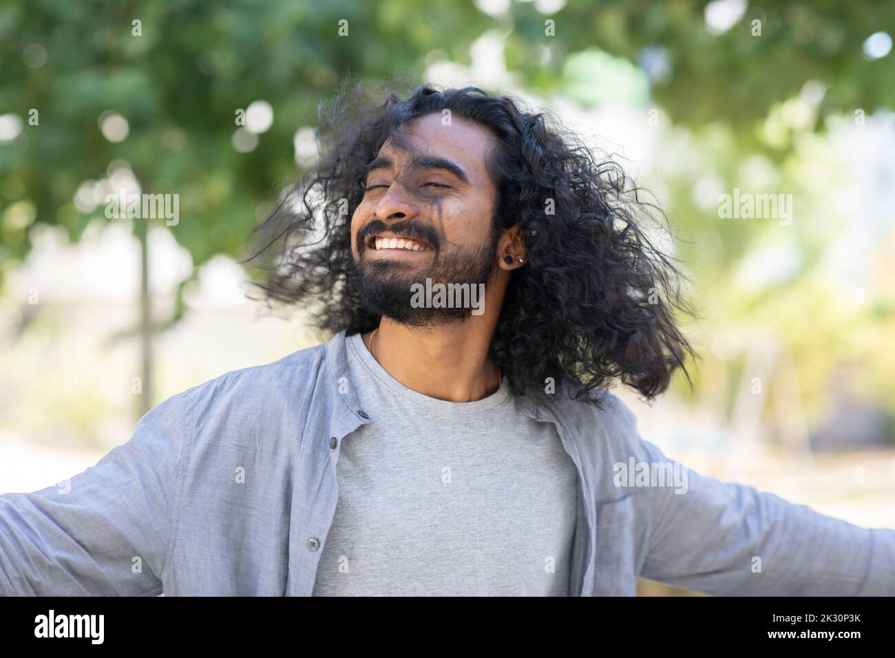 Young man smiling eyes closed hi-res stock photography and images - Alamy