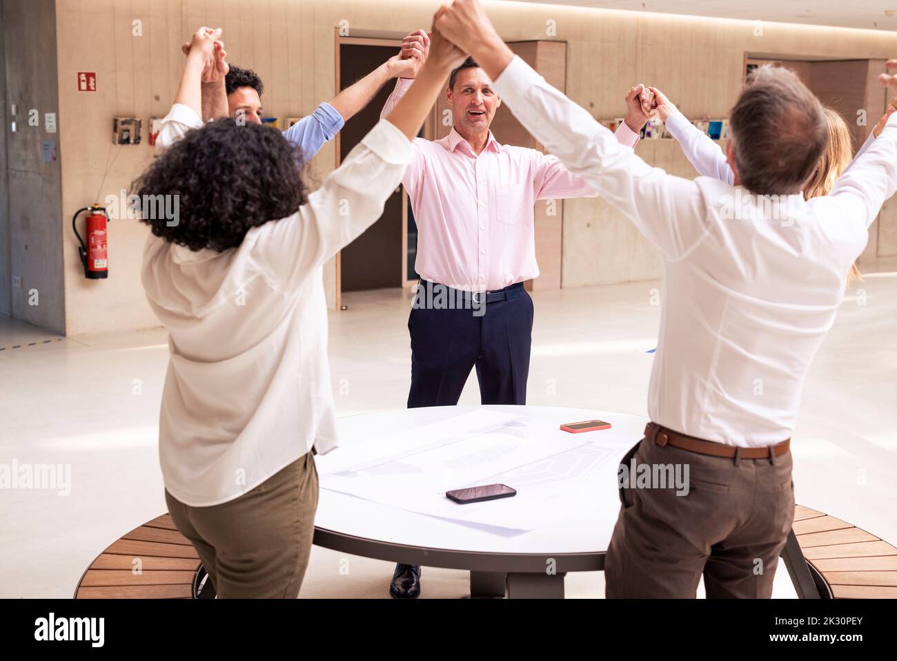 Group business people holding hands hi-res stock photography and images - Alamy